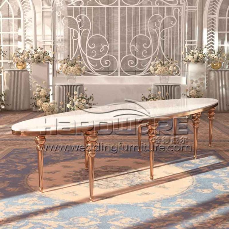Oval dining table with rose gold 3 ball legs