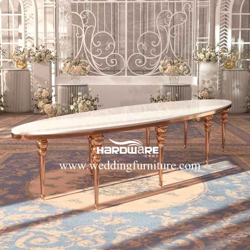 Oval dining table with rose gold 3 ball legs